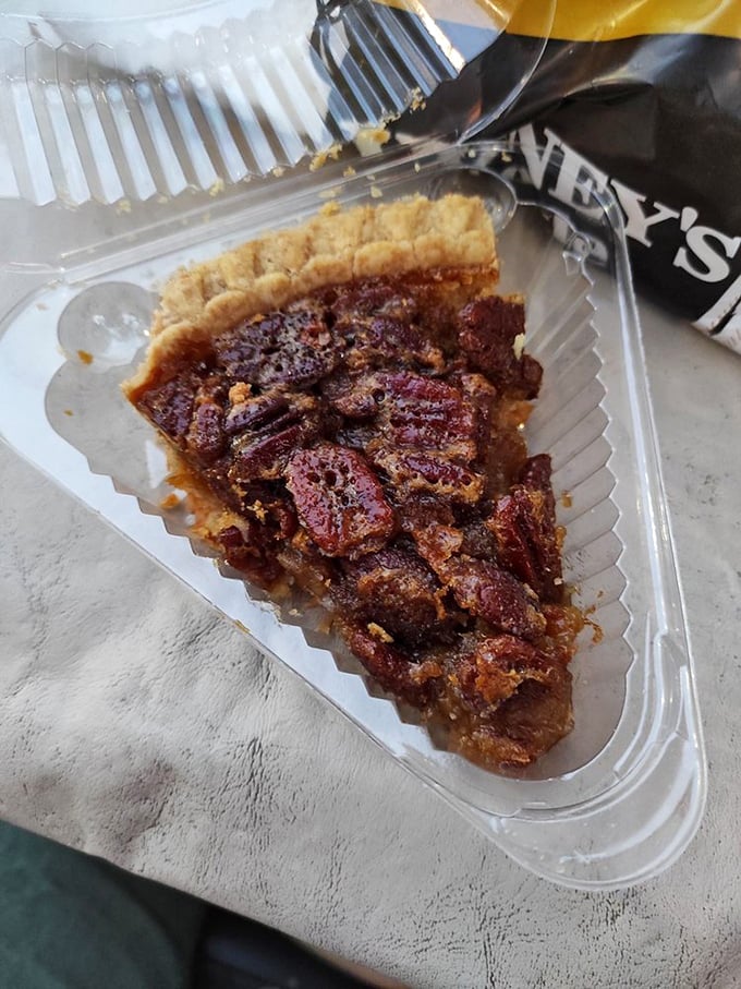 Pecan pie that would make your Southern grandmother weep with joy, nestled in its humble takeout container.