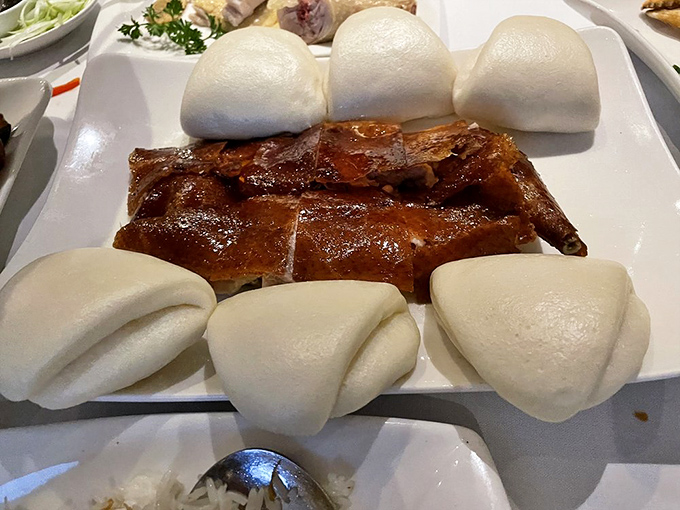 Peking duck served with pillowy bao buns is the choose-your-own-adventure book of Chinese cuisine. Each bite is a perfectly customized flavor story.