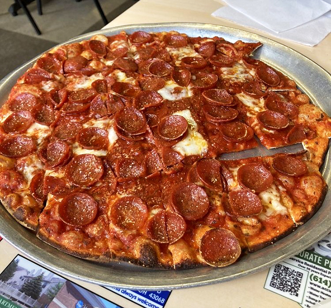 Pepperoni that curls into crispy cups, creating tiny pools of flavor that would make even the most sophisticated food critic forget about artisanal anything.