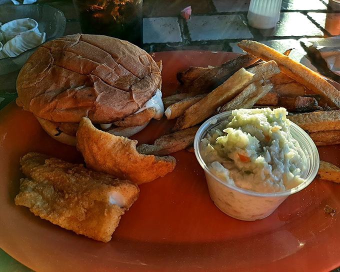 A proper perch sandwich doesn't need fancy frills, just fresh fish, a soft bun, and a side of creamy coleslaw to seal the deal.
