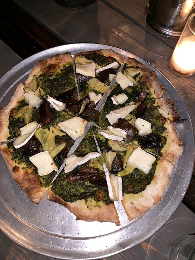 This isn't just pizza&mdash;it's a garden party on a crust, where pesto plays host and artichokes mingle with perfectly melted cheese.