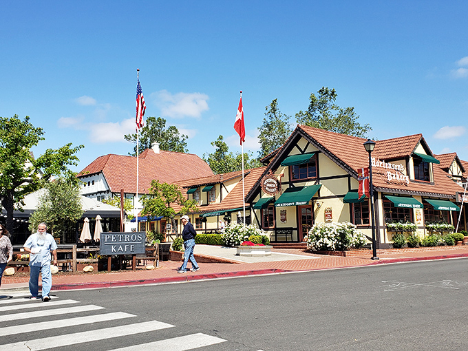 Danish flags flutter alongside Stars and Stripes at Petros Kafe, where Mediterranean meets Scandinavian in a culinary plot twist.
