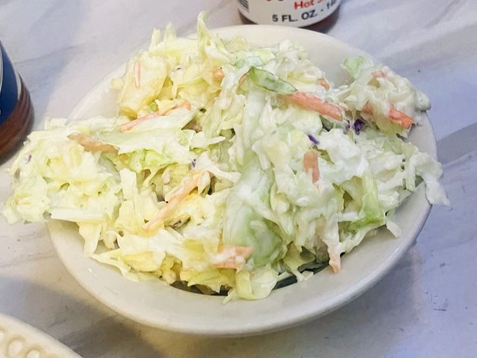 Coleslaw that knows its supporting role&mdash;crisp, fresh, and mercifully not drowning in mayo. The perfect cool counterpoint to hot chicken.