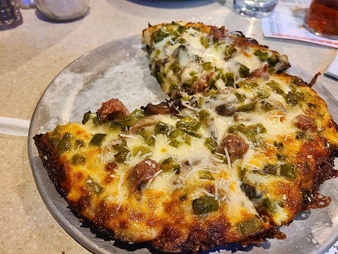 Pizza perfection doesn't need fancy toppings. This pie with green peppers and sausage proves that sometimes the classics endure for good reason.