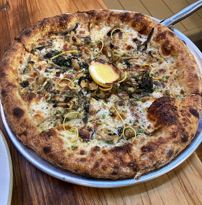 Wood-fired pizza with a crust that achieves the holy trinity: crispy, chewy, and charred in all the right places.
