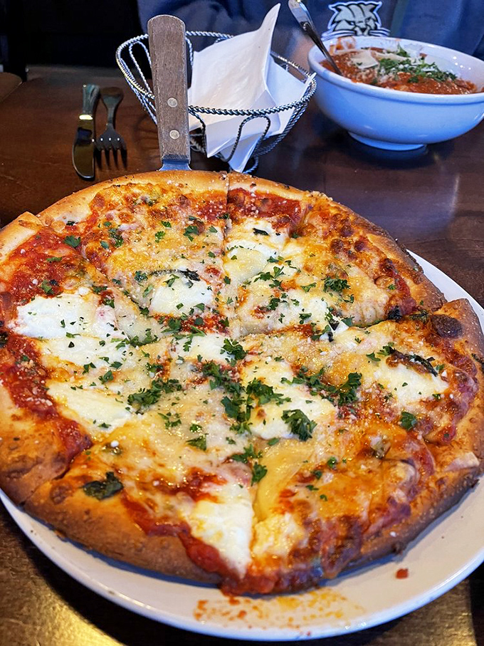 This pizza achieves that perfect balance of crispy crust and melted cheese that makes grown adults weep.