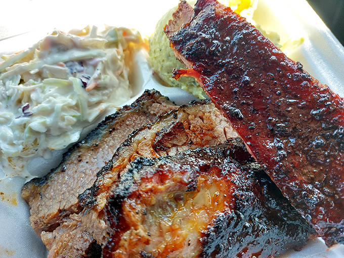These ribs and brisket with their glistening bark are what BBQ dreams are made of. Coleslaw never had such distinguished company.
