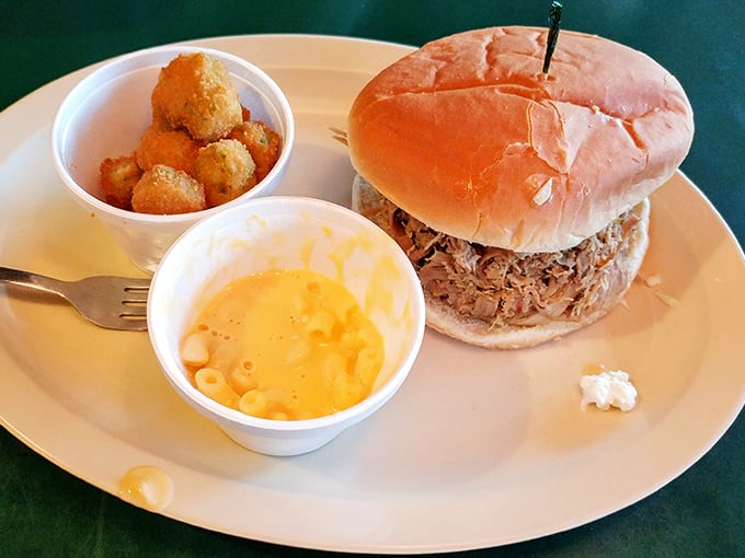 A pulled pork sandwich that doesn't need fancy dress-up&mdash;just honest meat, a soft bun, and sides that know their supporting role. Comfort on a plate.