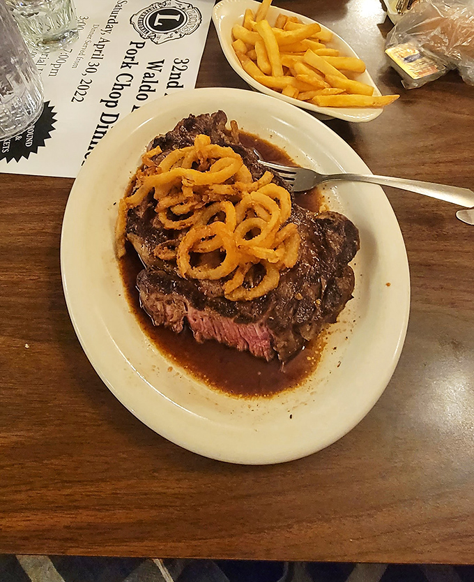 Prime rib that doesn't mess around. Topped with crispy onion strings and swimming in au jus &ndash; this is Wisconsin's idea of portion control.