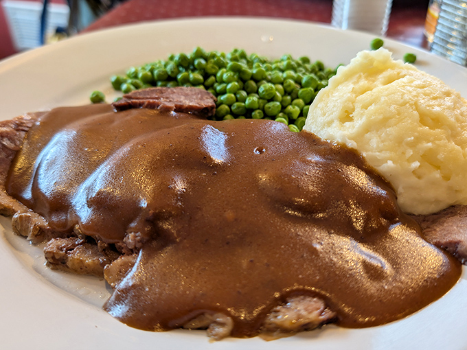 Pot roast that doesn't just fall apart&mdash;it surrenders completely, surrounded by mashed potatoes standing by to soak up that glorious gravy.