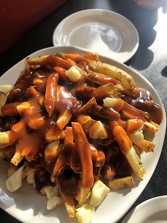 These loaded fries prove that sometimes more is definitely more, especially when cheese curds are involved.