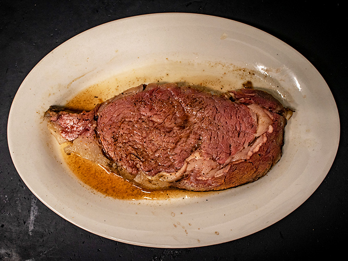 Prime rib so perfectly pink it could make a vegetarian question their life choices. This isn't just meat; it's a masterpiece.