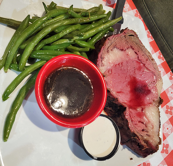Prime rib so perfectly pink it could make a vegetarian question their life choices. The accompanying au jus isn't a condiment&mdash;it's liquid gold.