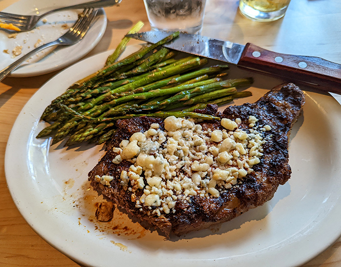 The Black and Blue Ribeye with asparagus isn't just dinner &ndash; it's what food dreams are made of when cheese meets beef.