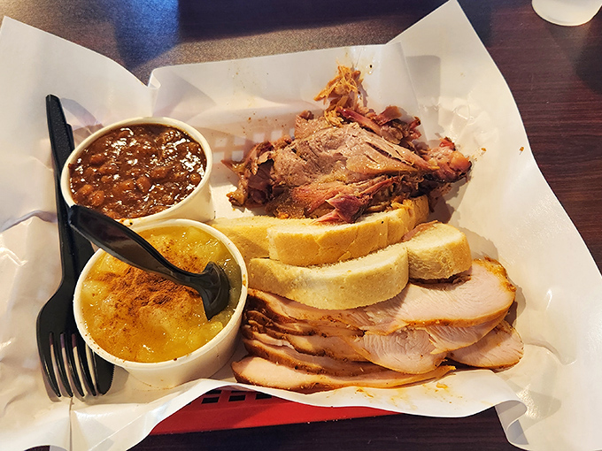 Pulled pork and sides nestled in butcher paper&mdash;the BBQ equivalent of being tucked into bed with a story. Sweet, smoky dreams are made of this.