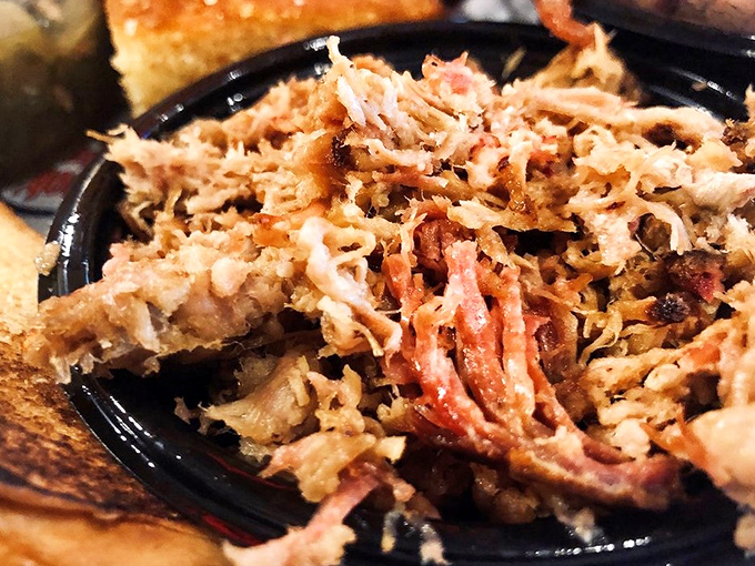 Pulled pork so tender it practically pulled itself. Those crispy edges mixed with succulent strands are what barbecue dreams are made of.