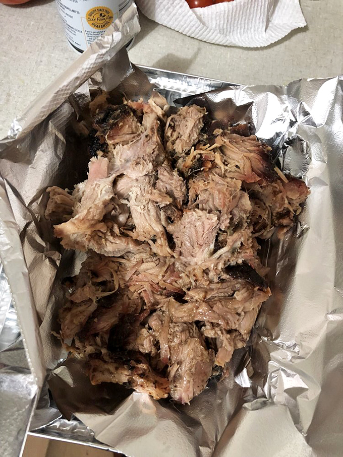 Pulled pork that looks like it's been coaxed apart by angels. Each strand carries the perfect balance of smoke, spice, and tenderness.