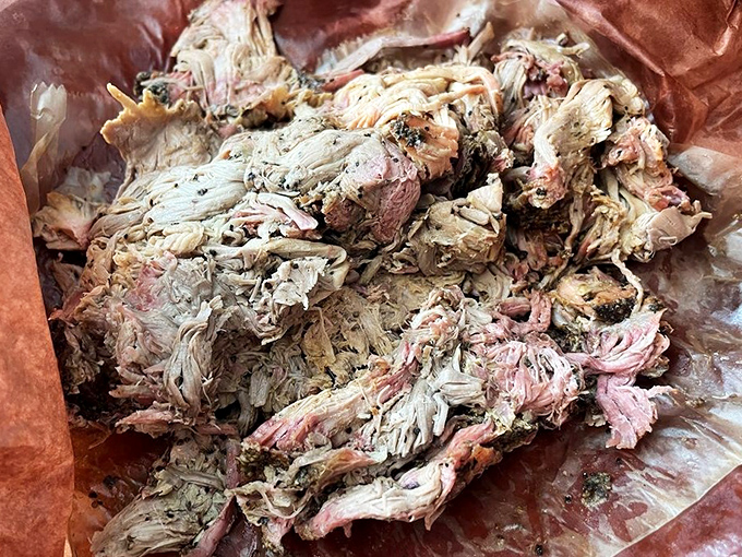 Pulled pork so tender, it practically volunteers to fall apart at first glance.