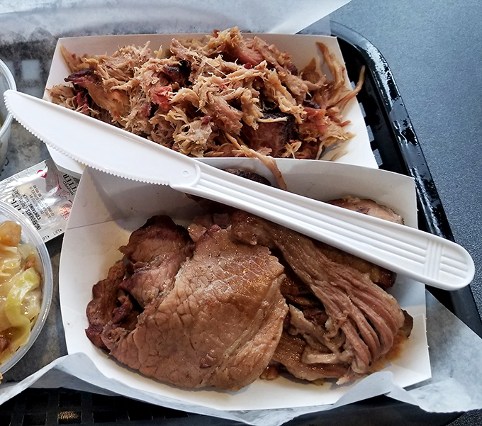 The pulled pork and brisket duet—a meat symphony so perfectly conducted you'll want to stand up and applaud between bites.