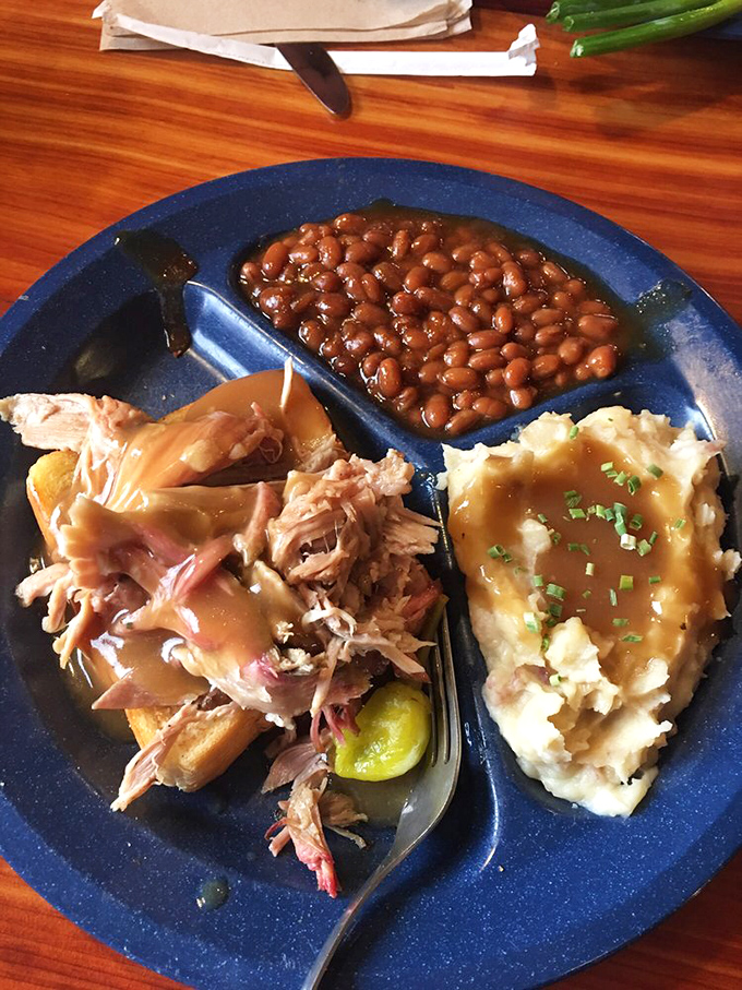 The pulled pork arrives with beans and those legendary mashed potatoes&mdash;a holy trinity of comfort that might just make you relocate to Missouri.