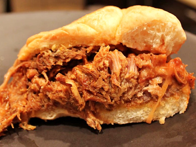 Tender pulled pork that falls apart like a perfectly choreographed dance of flavor and texture.