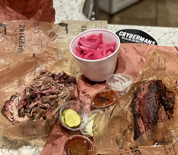 The barbecue spread that launches a thousand road trips. Those pink pickled onions aren't just garnish – they're the perfect acidic counterpoint to smoky perfection.