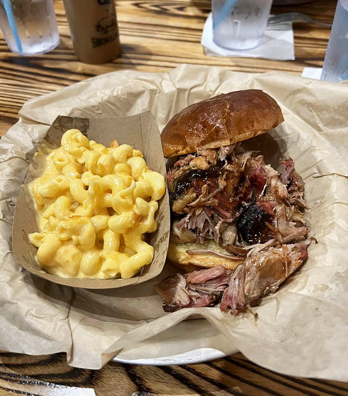 A pulled pork sandwich that's practically bursting its seams, paired with mac & cheese that's achieved that mythical perfect creaminess. Name a better duo.