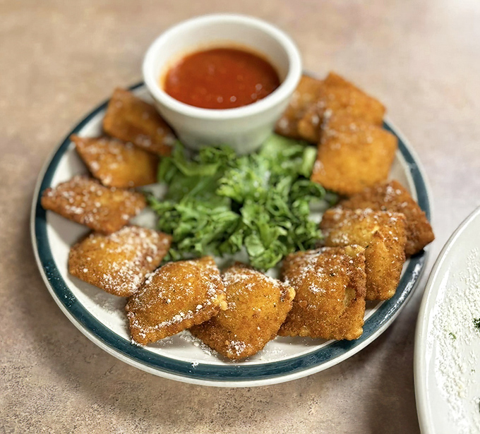 Golden-fried ravioli arranged like a delicious clock face, with marinara standing by for its inevitable dipping destiny.