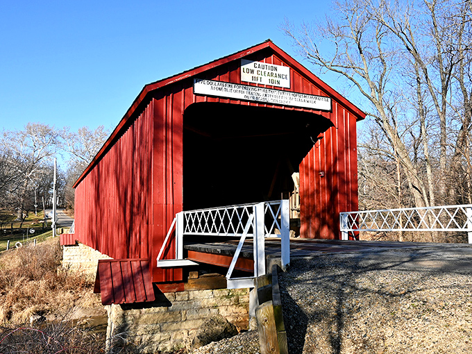 The Red Covered Bridge stands as a crimson time machine, inviting travelers to cross through history at a leisurely 10 mph.