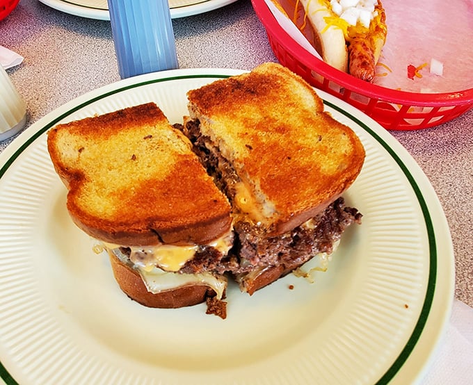 Not just a Reuben burger, but a declaration of deliciousness&mdash;toasted bread hugging seasoned beef, melty cheese, and tangy sauerkraut in a sandwich that demands to be photographed before devoured.