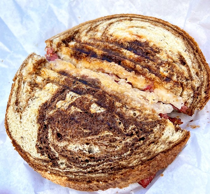 The marbled rye, the perfect ratio of meat to sauerkraut &ndash; this Reuben isn't just a sandwich, it's a masterclass in balance and texture.