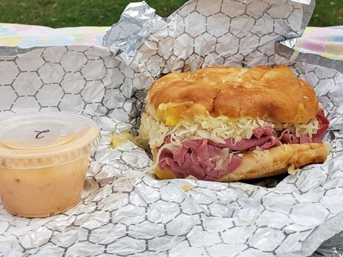 This Reuben isn't just a sandwich; it's an architectural achievement with layers of meat and sauerkraut that would make any deli owner weep with joy.