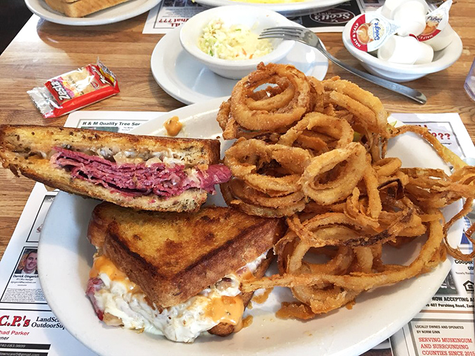 The Reuben demands your respect and full attention, but those onion rings? They're the supporting actors who steal the entire show.