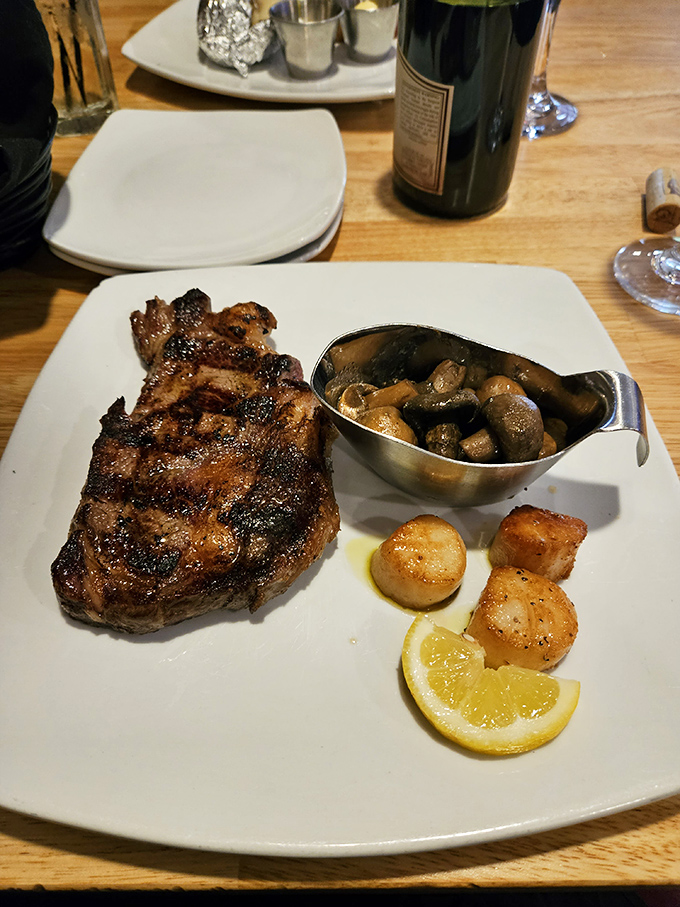 A ribeye that deserves its own ZIP code, with mushrooms and scallops playing perfect wingmen. That char speaks a language all meat lovers understand.