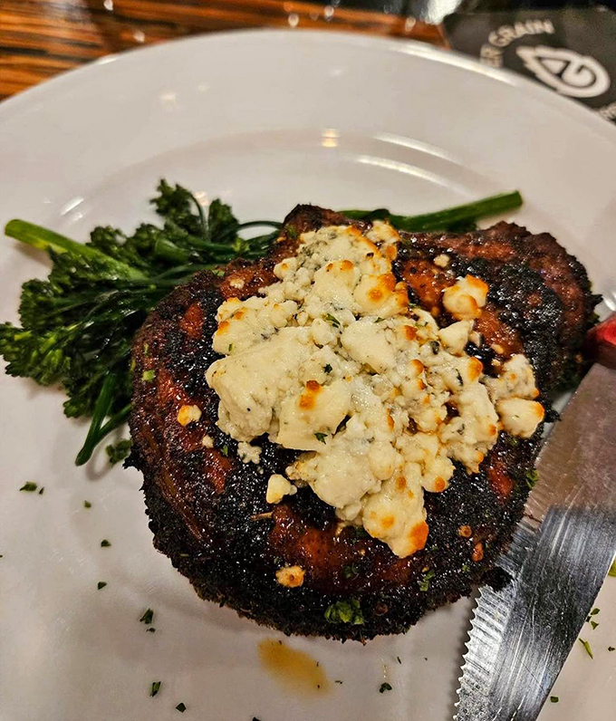 A ribeye topped with blue cheese that makes you wonder why you'd ever order anything else. The char marks are basically a work of art.