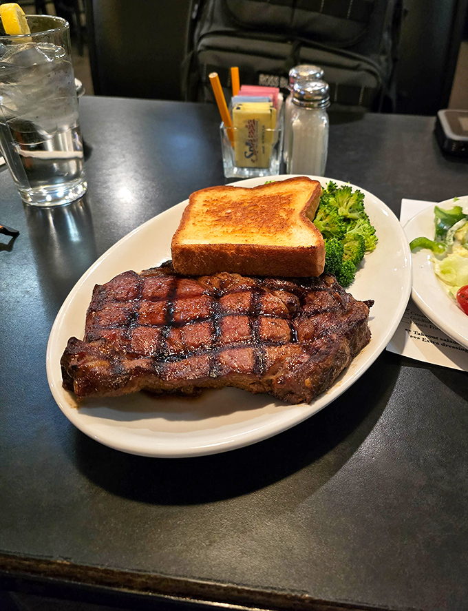 Grill marks aren't just for show – this perfectly seared ribeye delivers the kind of carnivorous satisfaction that makes vegetarians question their life choices.