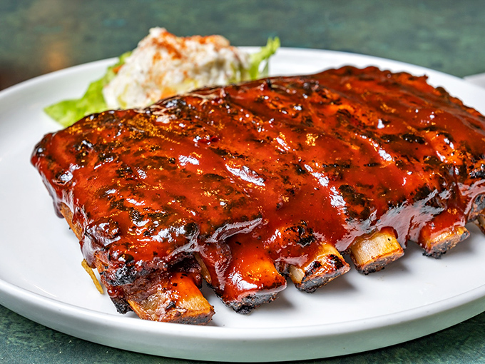 Ribs so tender and sauce-lacquered they make you question whether table manners were just a cruel joke society played on us.