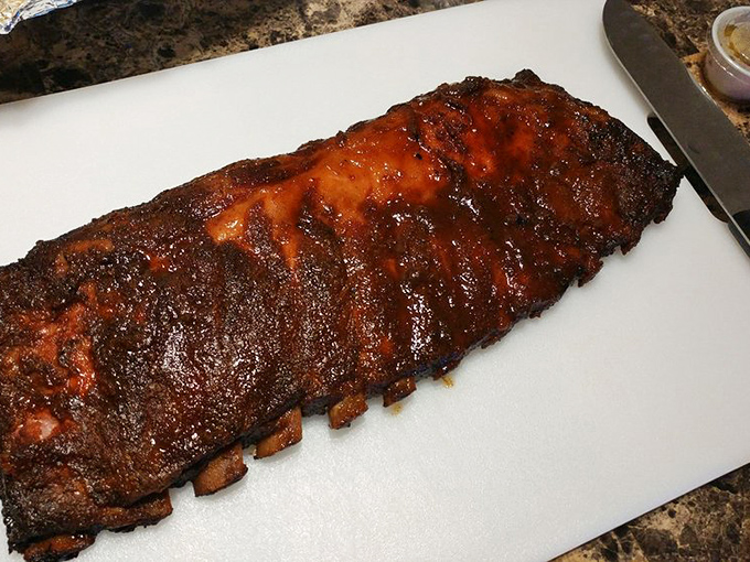 These ribs have the kind of bark that makes tree trunks jealous. The glossy finish isn't vanity&mdash;it's a testament to hours in the smoker.