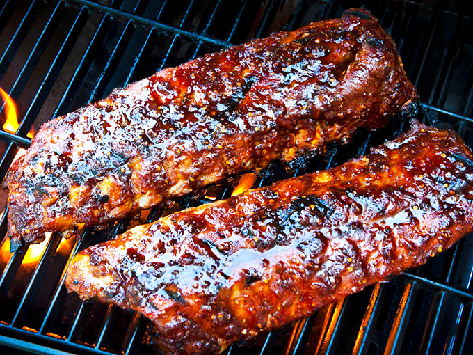 Ribs so tender they practically surrender before your fork arrives, glistening with barbecue hall-of-fame potential.