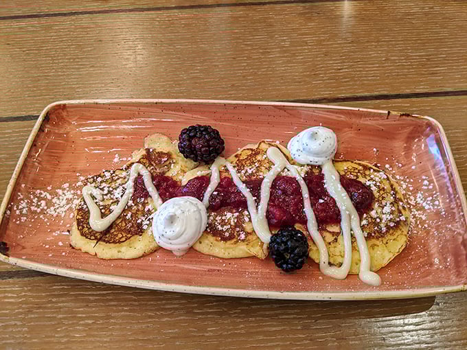 Ricotta pancakes so fluffy, they could double as edible clouds with a berry crown on top.