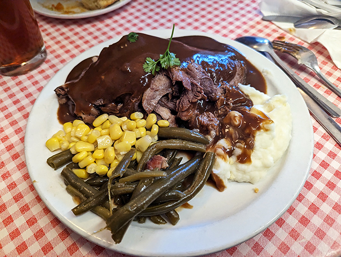 Tender roast beef swimming in rich gravy alongside fresh vegetables &ndash; comfort food that earns straight A's every time.