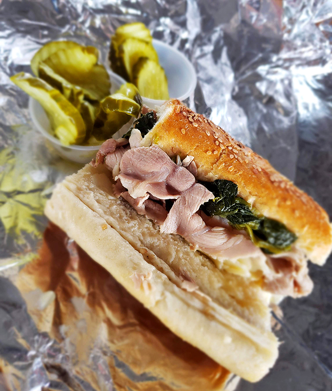 The legendary roast pork sandwich with broccoli rabe and pickles on the side. Poetry in sandwich form that makes grown adults weep with joy.