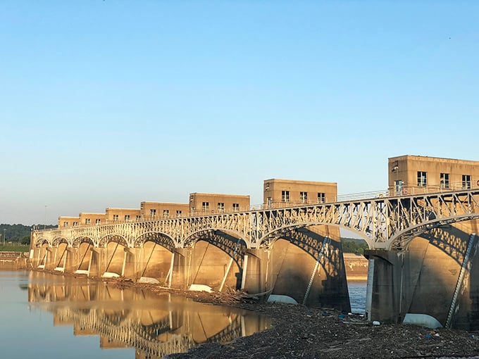 The Robert C. Byrd Lock and Dam stretches across the Ohio River like a concrete centipede, controlling the water that shaped this town's destiny.