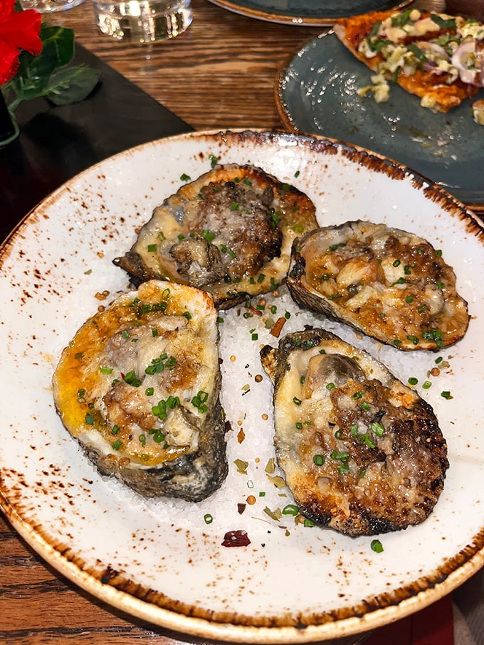 Oysters Rockefeller gets a modern makeover. These briny beauties are transformed with savory toppings that make sharing optional, but not recommended.