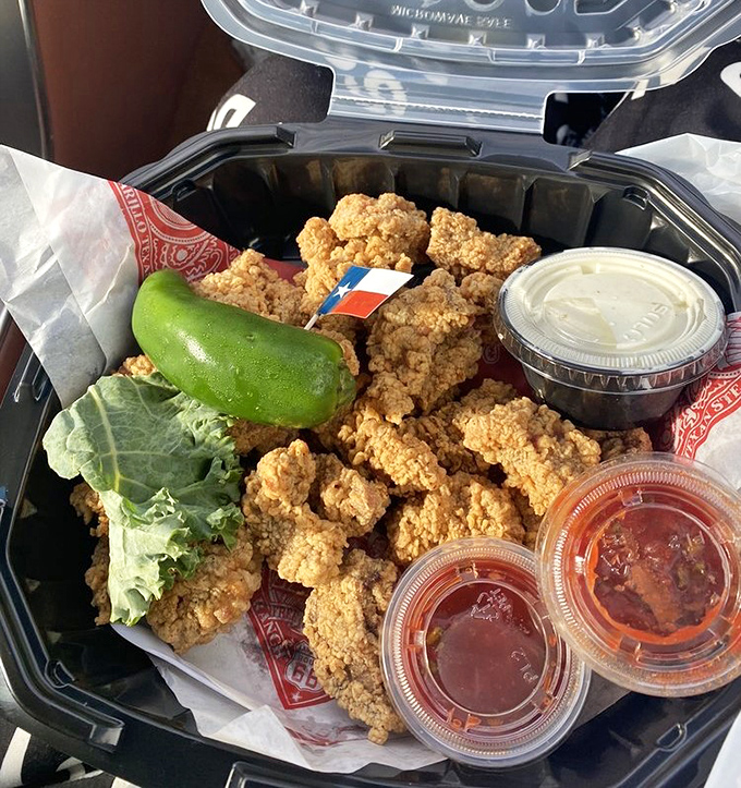 Golden-fried chicken strips that would make the Colonel jealous. That tiny Texas flag isn't compensating&mdash;it's just reminding you where good food comes from. 