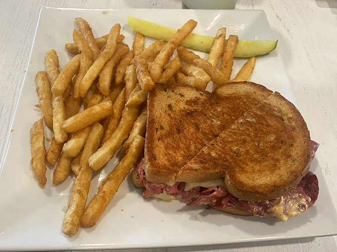 A proper Reuben should require both hands and several napkins. This golden-grilled masterpiece meets all sandwich protocol requirements with flying colors.