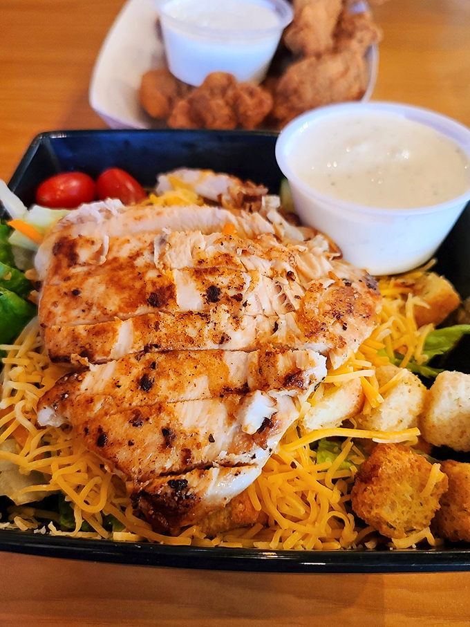 Who said salads can't be exciting? This grilled chicken masterpiece proves that "eating light" doesn't have to mean sacrificing flavor or leaving hungry.