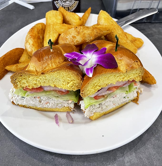 The sandwich that launched a thousand cravings, with those legendary home fries standing guard like golden, crispy sentinels of satisfaction.