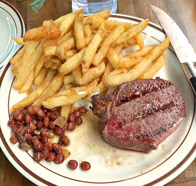The holy trinity of Central Coast dining: perfectly grilled steak, golden fries, and those legendary pinquito beans. Simplicity that makes five-star restaurants seem like they're trying too hard.