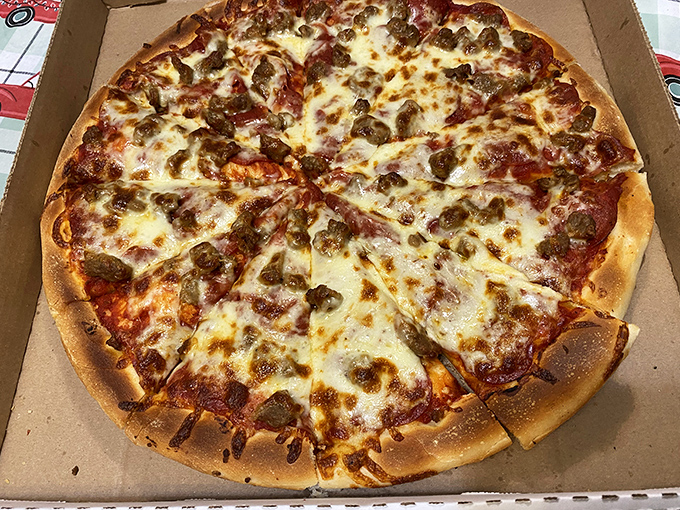 A symphony of sausage and cheese on a golden crust canvas&mdash;this isn't just pizza, it's edible artwork for the masses.